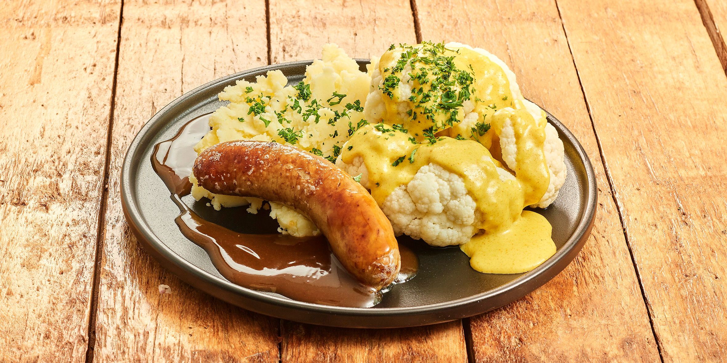 Gebraden worst met puree en bloemkool in kerrie | Uitgekookt