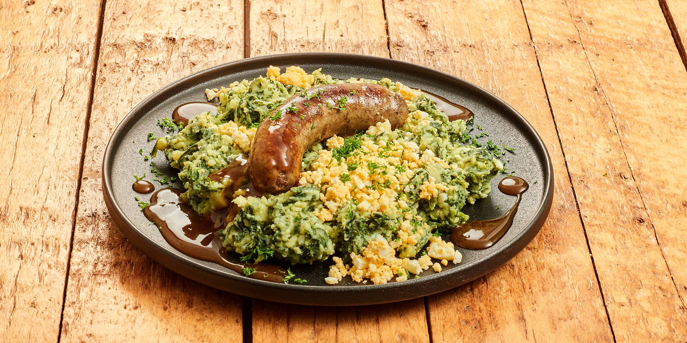 Stamppot spinazie met ei en een gebraden worst | Uitgekookt