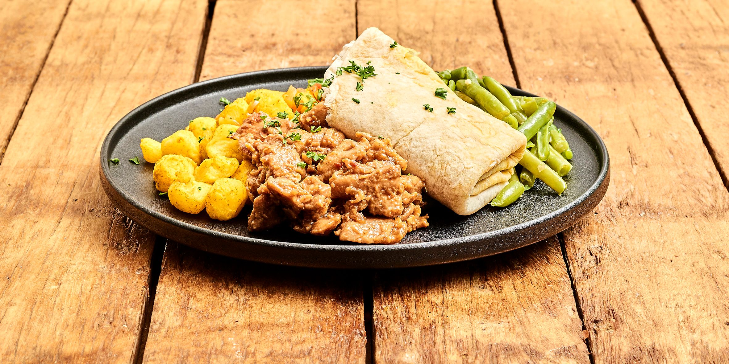 Surinaamse roti met curry van kip en aardappelen | Uitgekookt